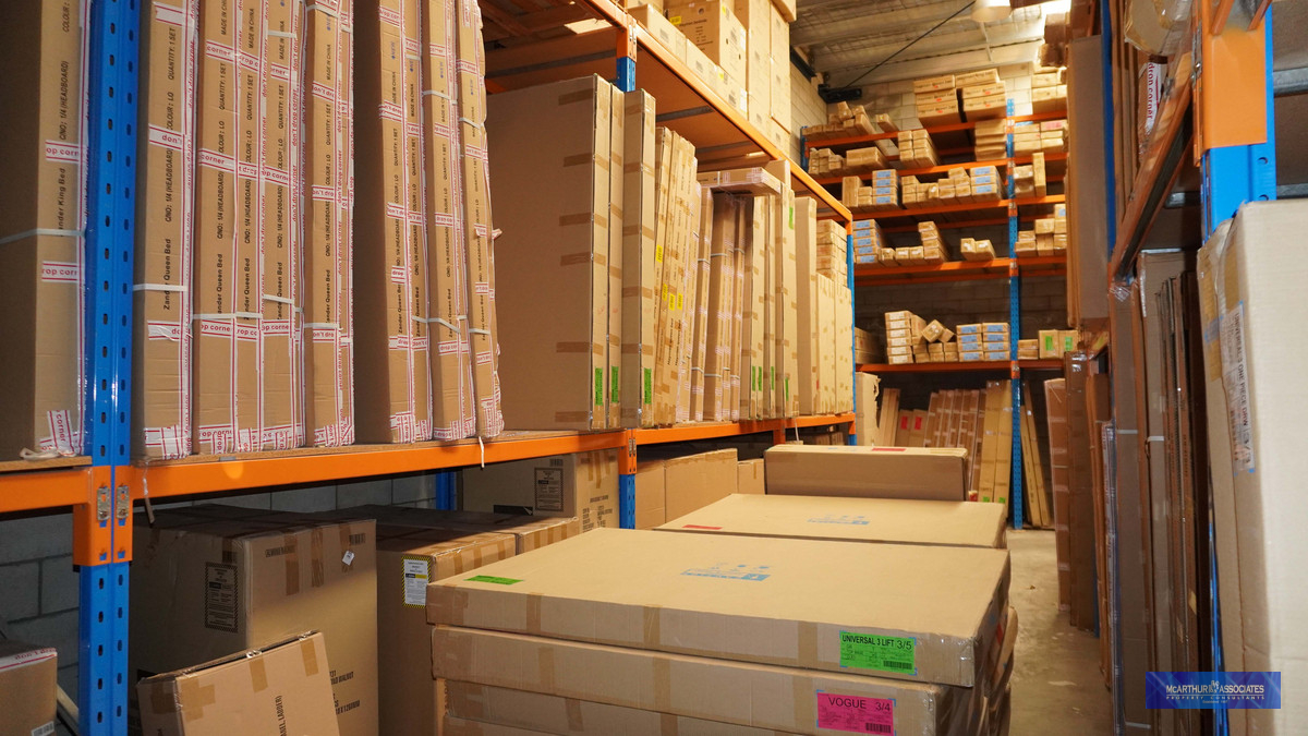 FREESTANDING WAREHOUSE WITH TWO CONTAINER HEIGHT ROLLER DOORS ...